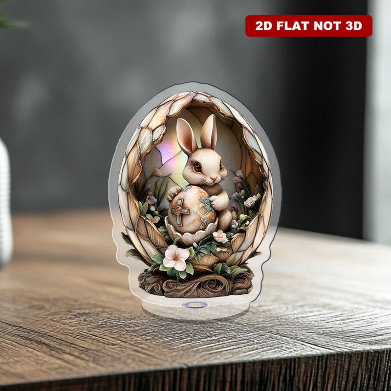 Rotating acrylic display features a charming bunny in an egg-shaped ...