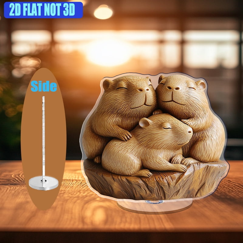 Rotating acrylic display features three hand-carved capybaras in rich ...