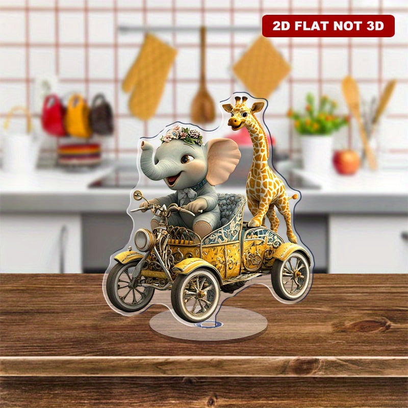 Rotating acrylic display featuring a baby elephant and giraffe on a ...