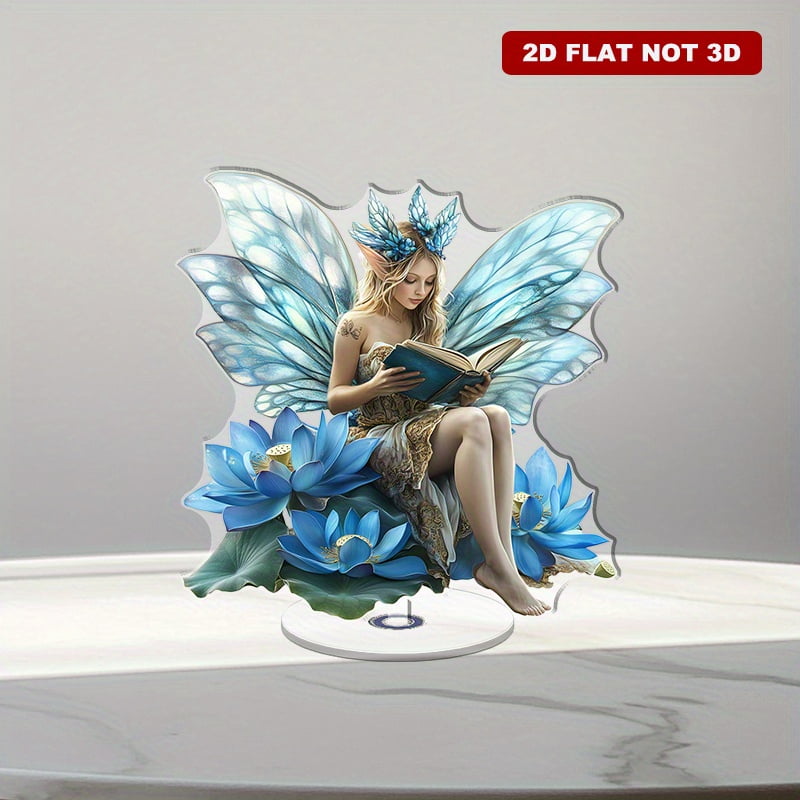 Rotating acrylic display featuring a beautiful fairy with large wings gracefully reading atop ...