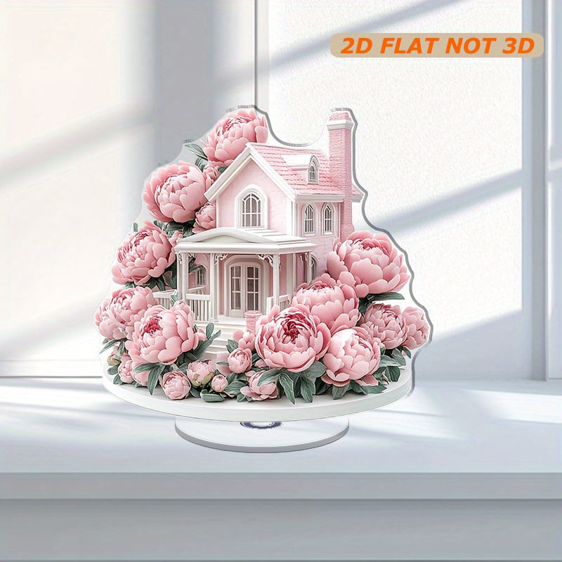 Rotating acrylic display featuring a charming house crafted from pink ...