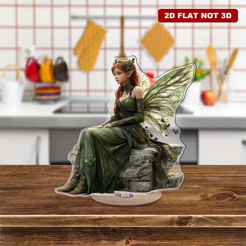 Rotating acrylic display featuring a detailed fairy in a green dress on ...