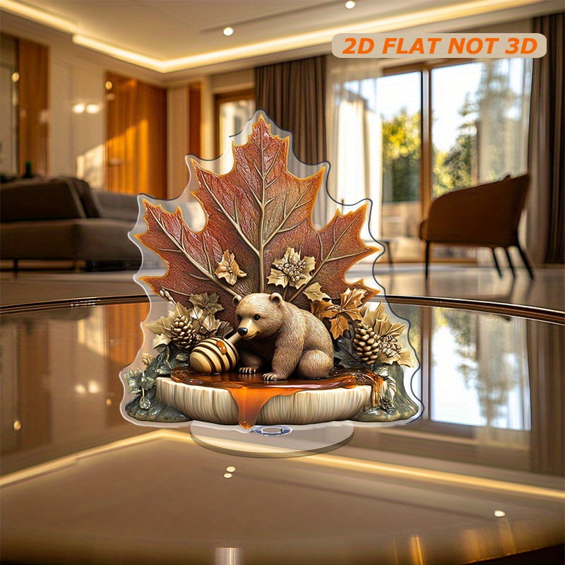 Rotating acrylic display featuring a detailed maple leaf sculpture with ...