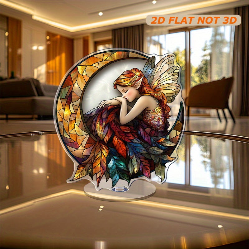 Rotating acrylic display featuring a fairy sleeping on a crescent moon surrounded by feathers ...