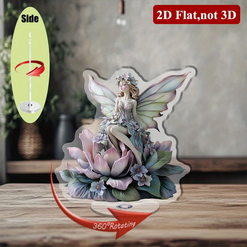 Rotating acrylic display featuring a graceful flower fairy with delicate wings sitting on a ...