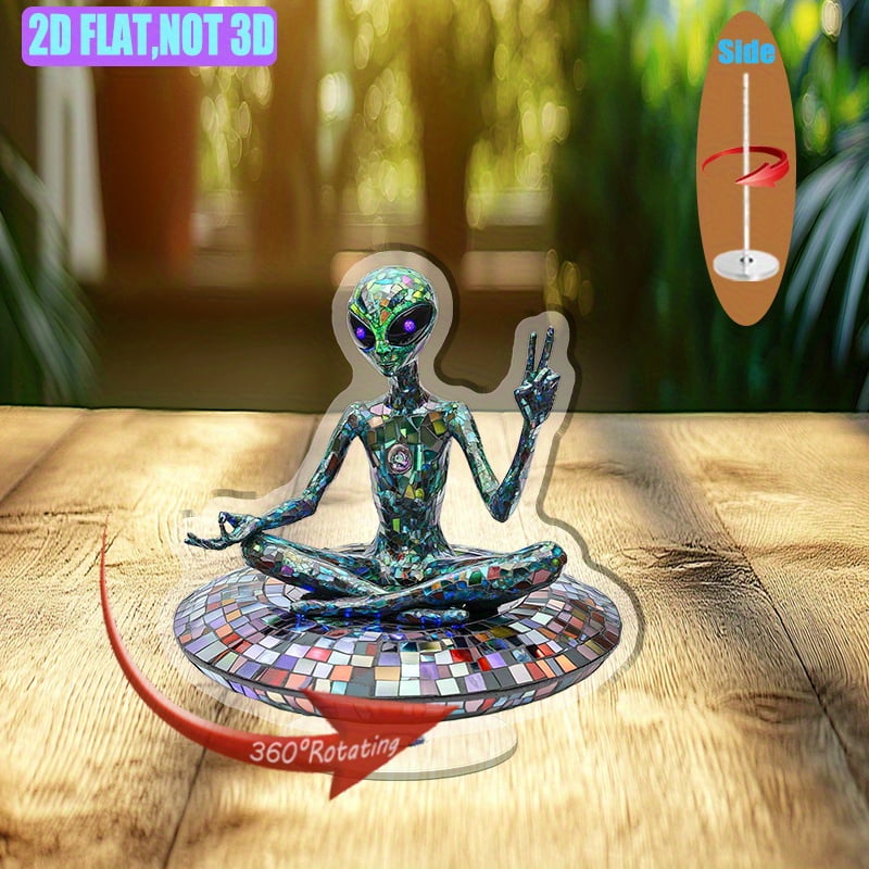 Rotating acrylic display featuring a green-skinned alien in a yoga pose ...