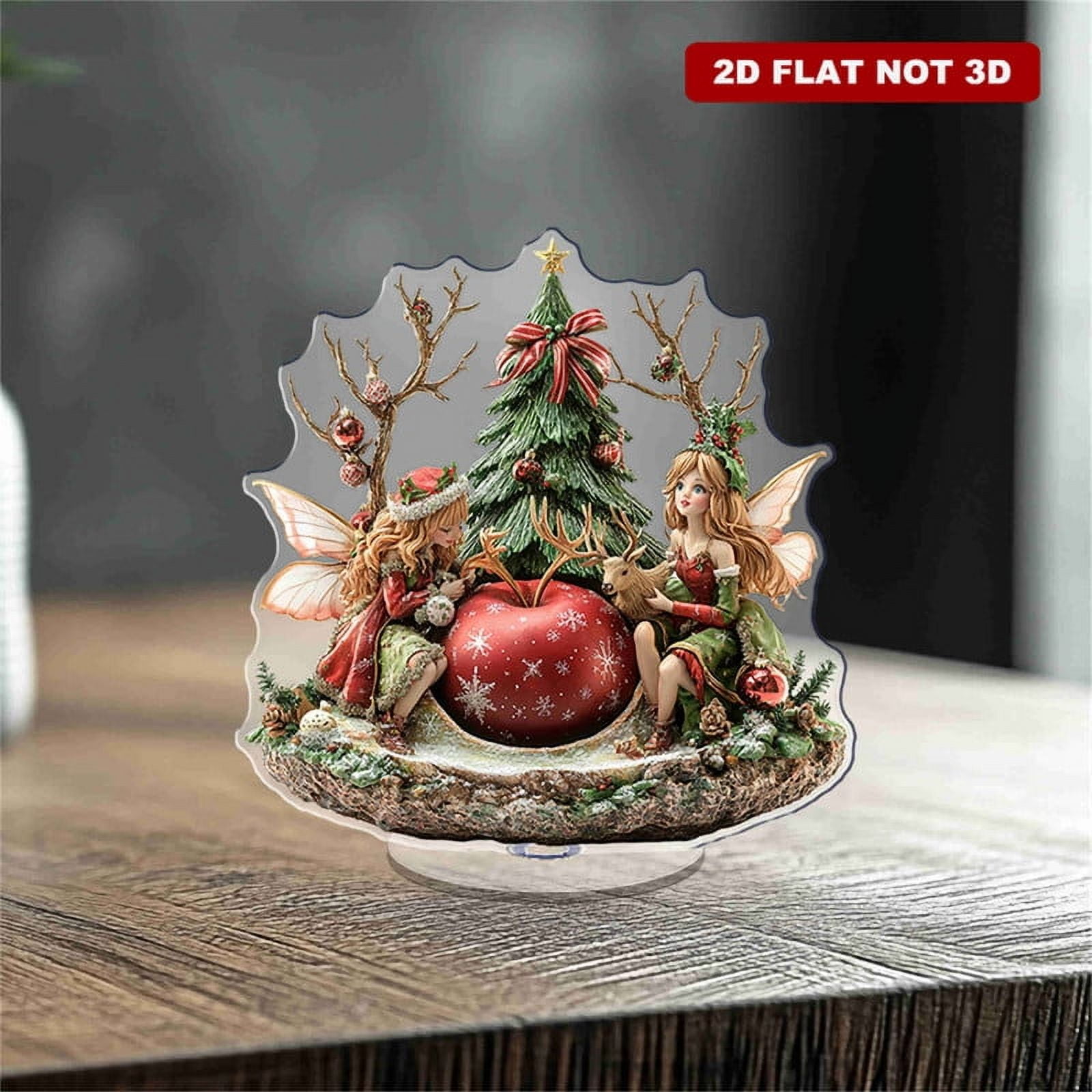 Rotating acrylic display featuring a hollowed apple two fairies with elk and a Christmas tree in ...