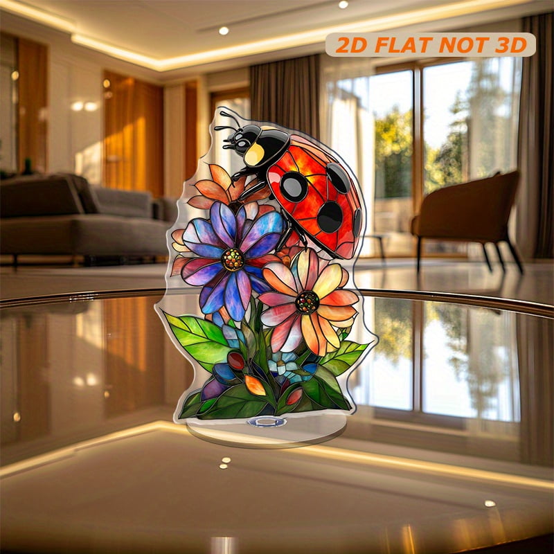 Rotating acrylic display featuring a hyper-realistic ladybug on ...