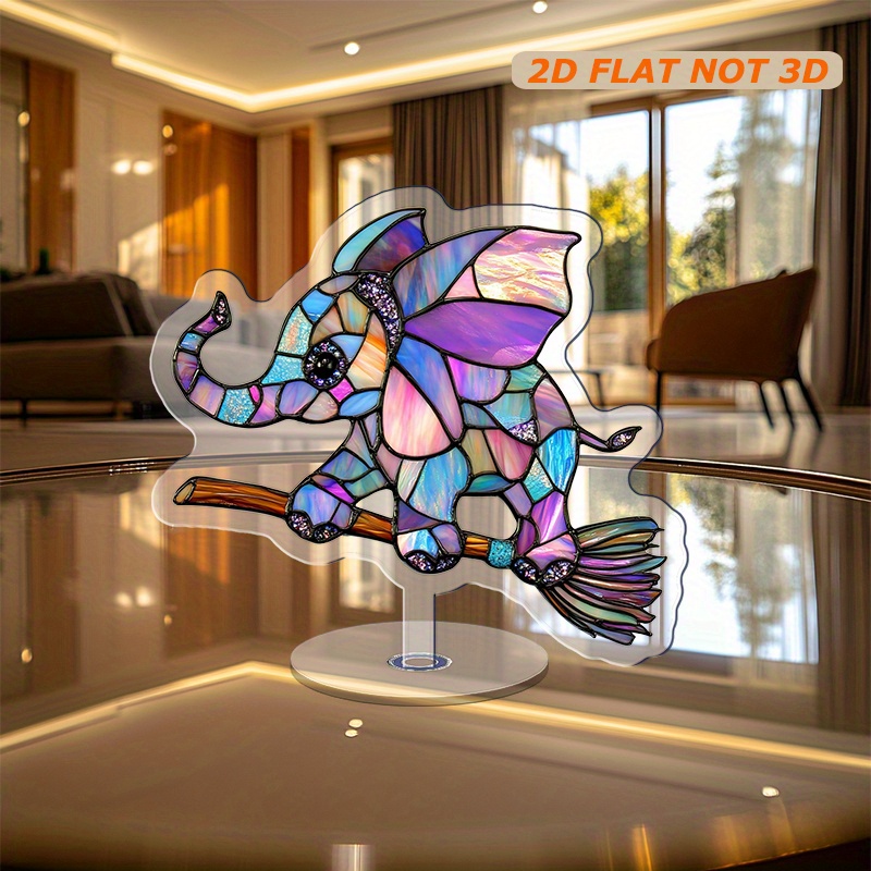 Rotating acrylic display featuring a whimsical stained glass flying ...