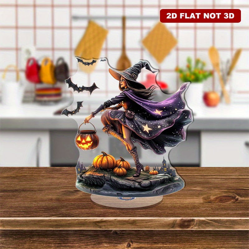 Rotating acrylic display featuring a witch on a broom with a glowing ...