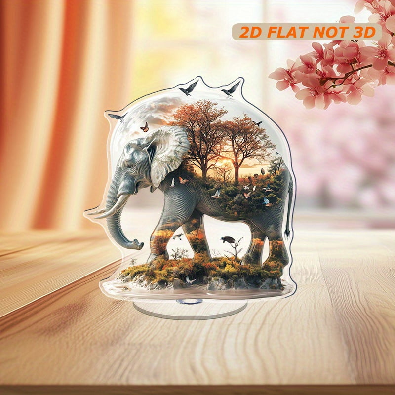 Rotating acrylic display featuring an elephant with trees and birds ...