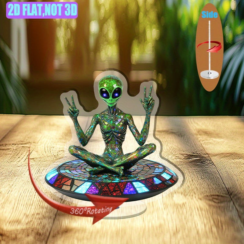 Rotating acrylic display featuring a green-skinned extraterrestrial in ...