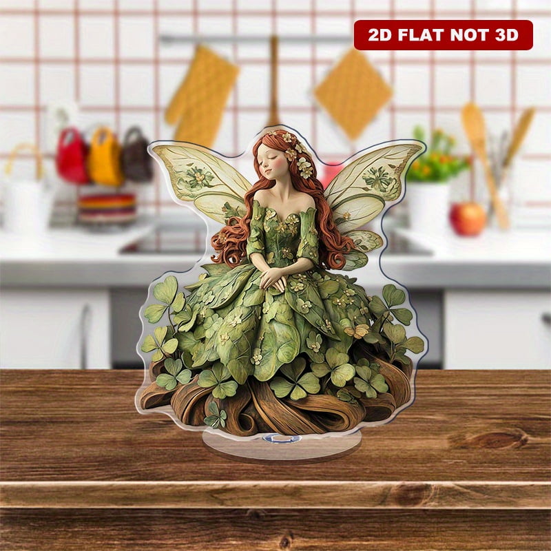 Rotating acrylic display featuring an intricately carved fairy in a lush green dress, with ...