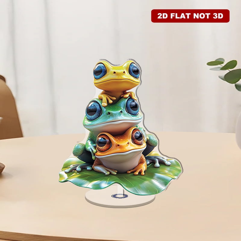 Rotating acrylic display featuring three colorful frogs on a lotus leaf ...