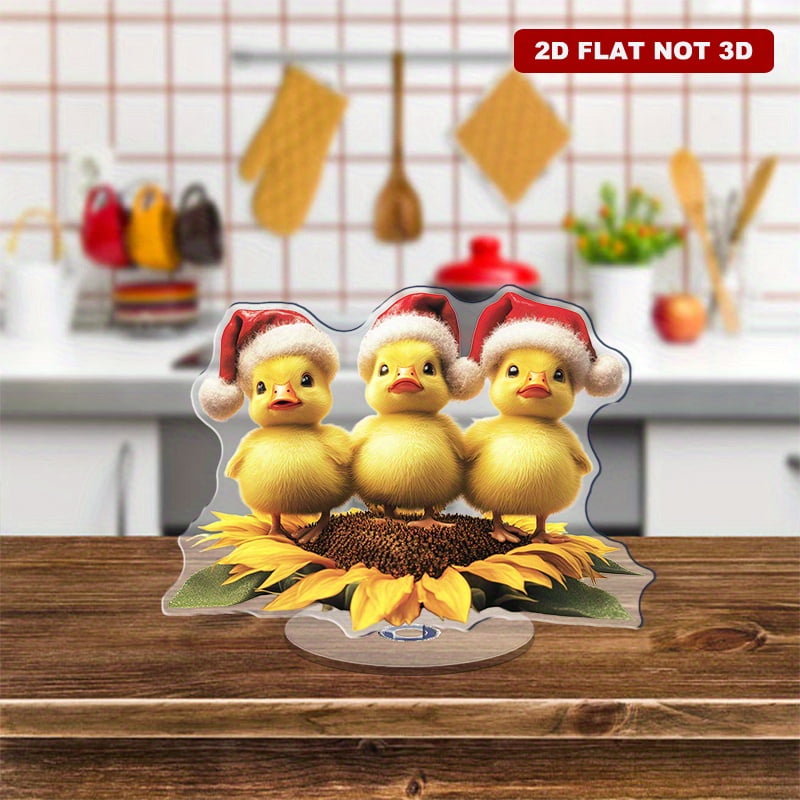 Rotating acrylic display featuring three detailed yellow ducks on a ...