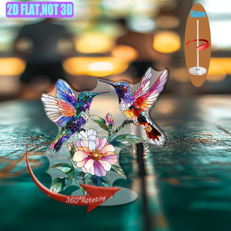 Rotating acrylic display featuring vibrant colorful hummingbirds near a ...