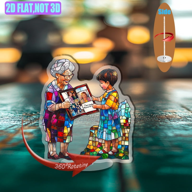 Rotating acrylic display showcasing a delighted grandmother with a ...