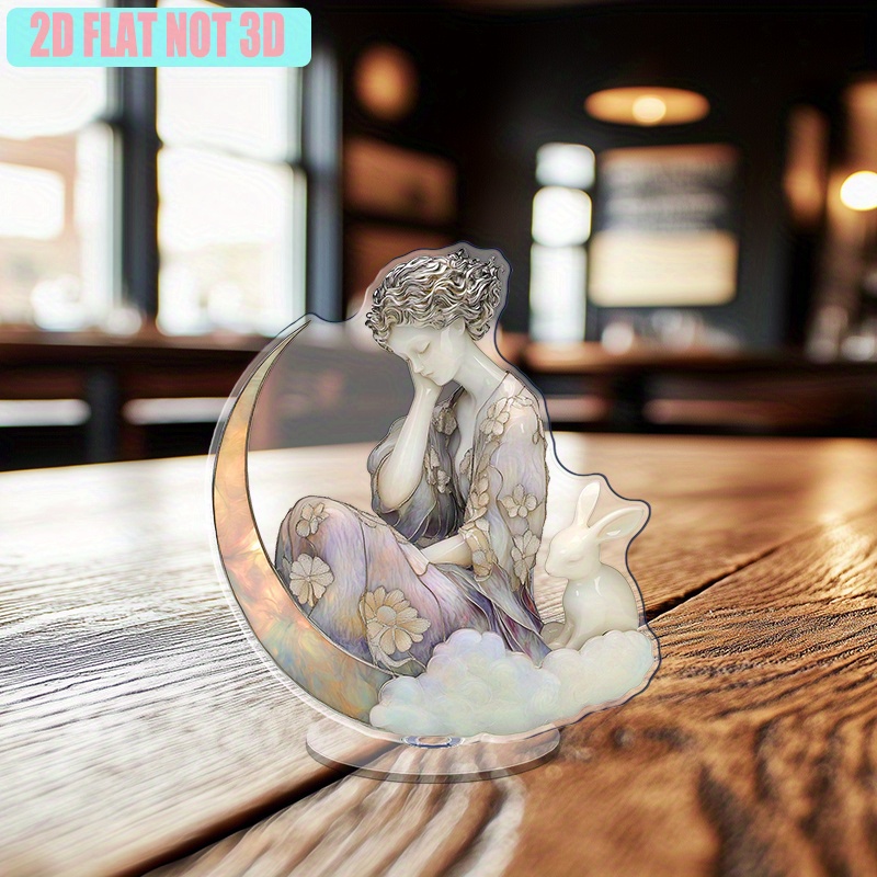 Rotating acrylic ornament features a figure crafted from leaded glass ...
