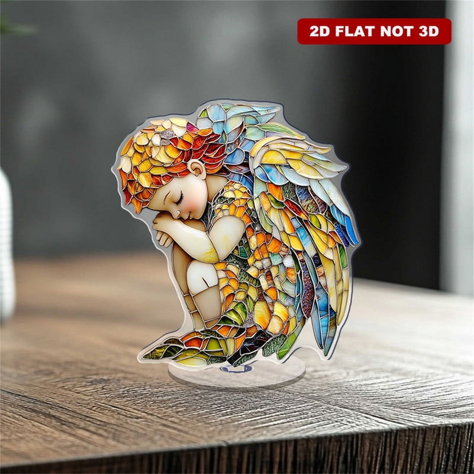 Rotating acrylic ornament features a vibrant angel design with ...