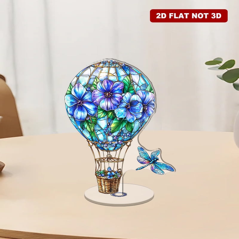 Rotating acrylic ornament features a glassy hot air balloon adorned ...