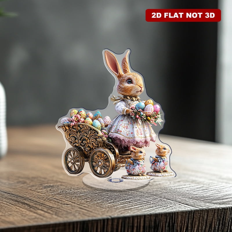 Rotating acrylic ornament features a whimsical rabbit with a barrow of ...