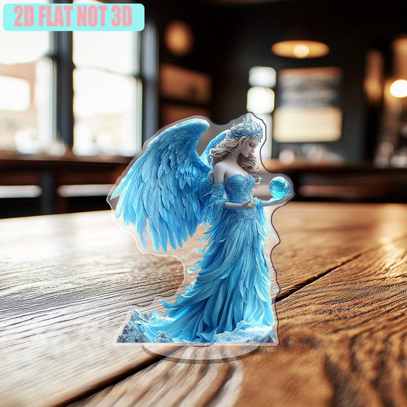 Rotating acrylic ornament featuring a blue-winged angel with a crystal ...
