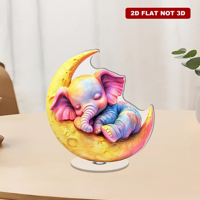 Rotating acrylic ornament featuring a colorful elephant sleeping on a ...