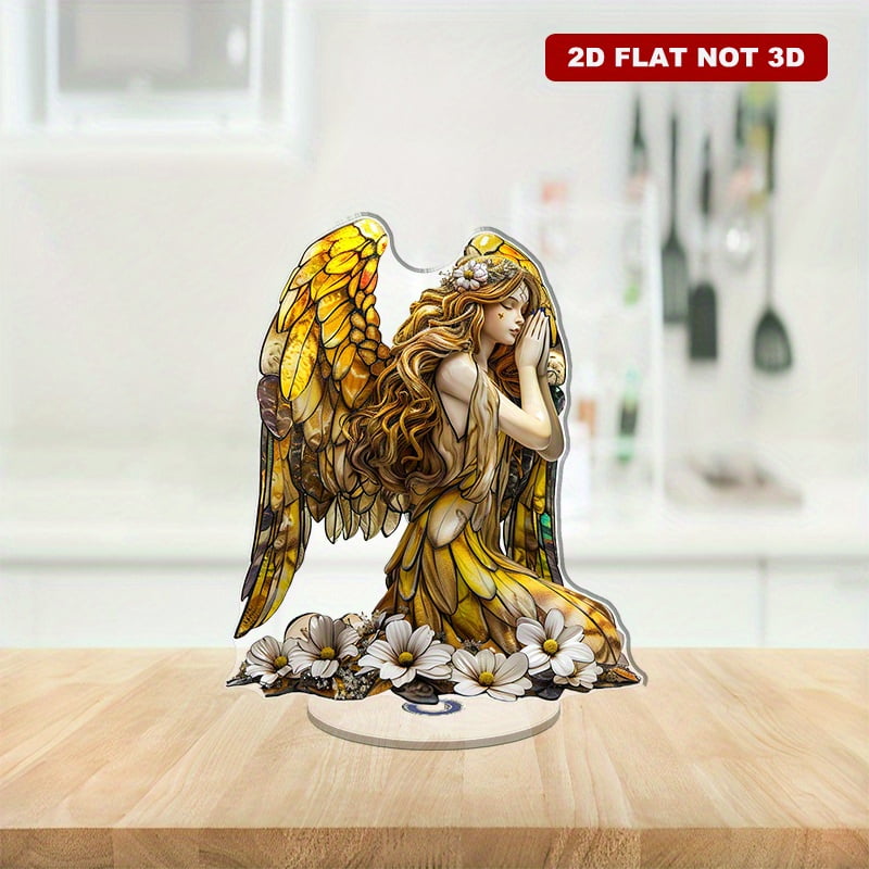 Rotating acrylic ornament featuring a kneeling angel with golden wings ...
