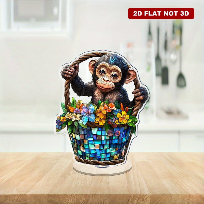 Rotating acrylic ornament featuring a monkey with a woven basket filled ...
