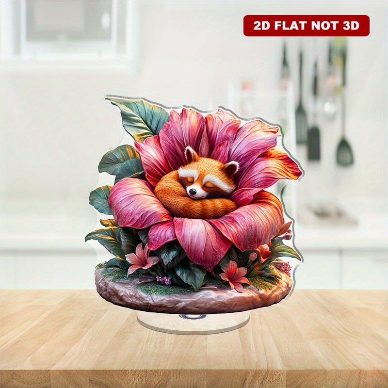 Rotating acrylic ornament featuring a raccoon sleeping in a giant ...