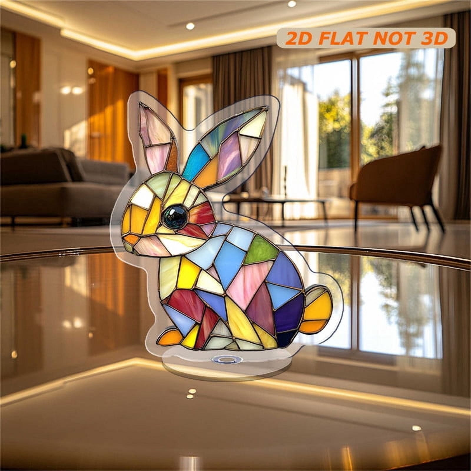 Rotating acrylic ornament featuring a shimmering glass bunny with ...