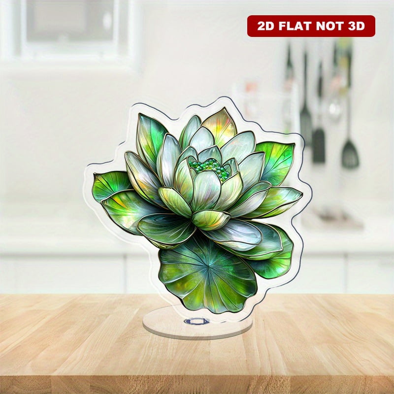 Rotating acrylic ornament featuring a shimmering green water lily and ...