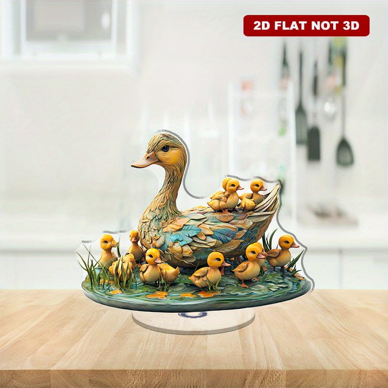 Rotating acrylic ornament featuring a vibrant duck and ducklings on a ...