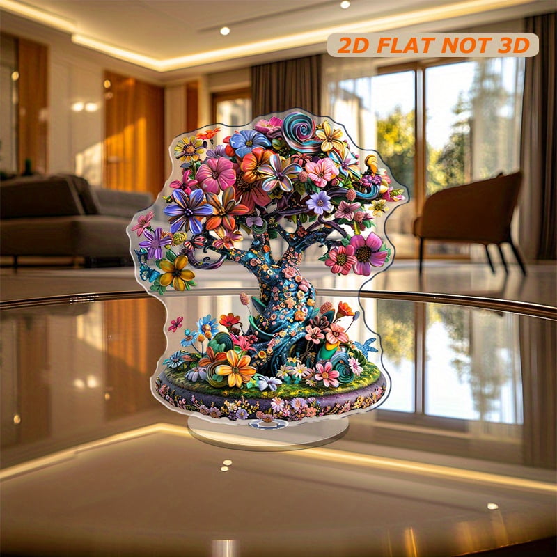 Rotating acrylic ornament featuring a vibrant tree of life on a base of ...