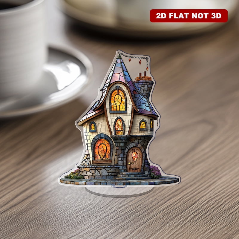Rotating acrylic ornament featuring a whimsical house in vibrant colors ...