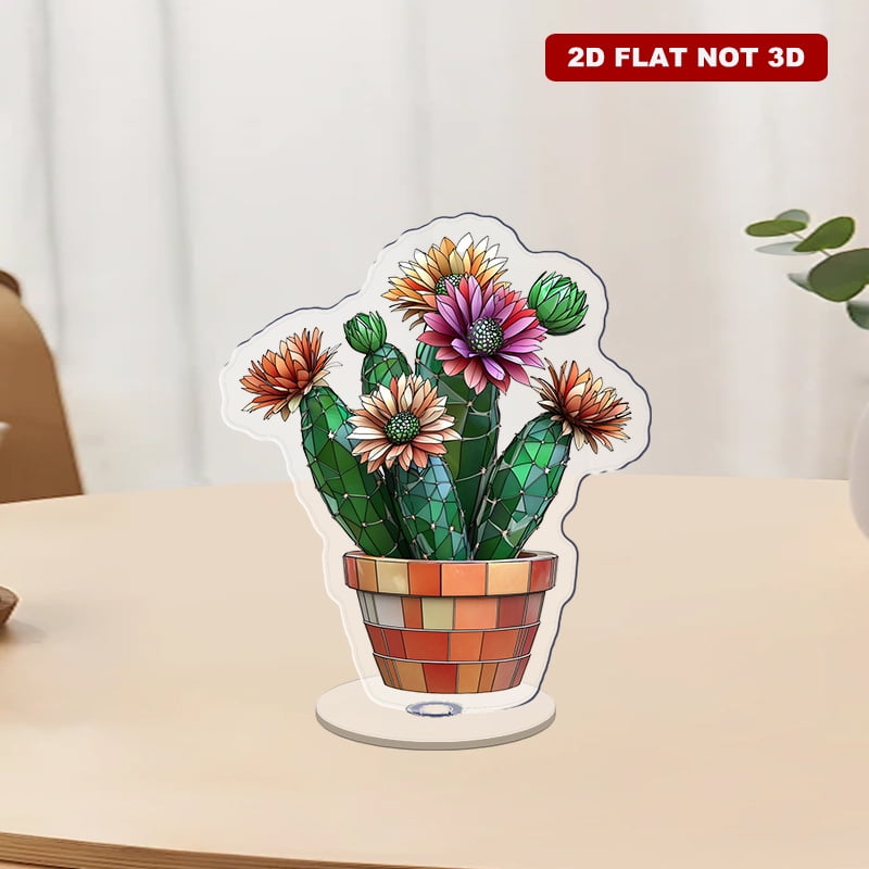 Rotating acrylic ornament featuring a cactus with vibrant flowers in a ...