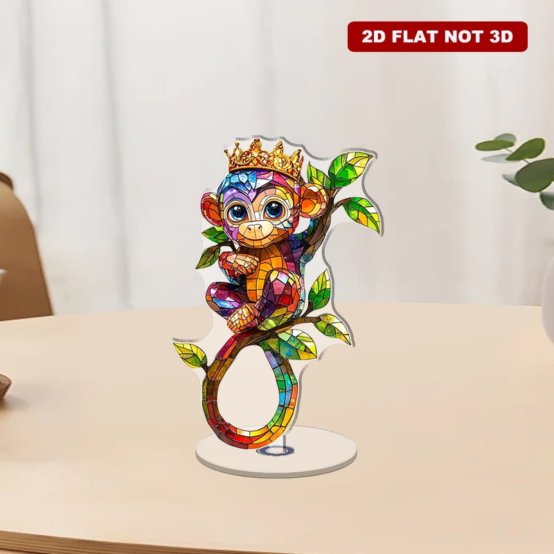 Rotating acrylic ornament featuring a colorful crowned monkey hanging ...