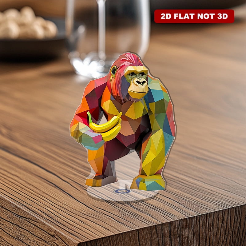 Rotating acrylic ornament featuring a colorful wooden gorilla holding a ...