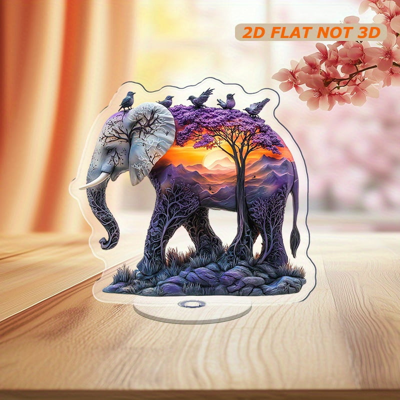 Rotating acrylic ornament featuring a detailed elephant with trees and ...
