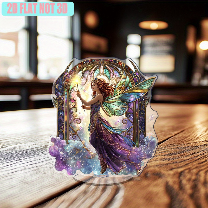 Rotating acrylic ornament featuring a fairy with a wand surrounded by ...