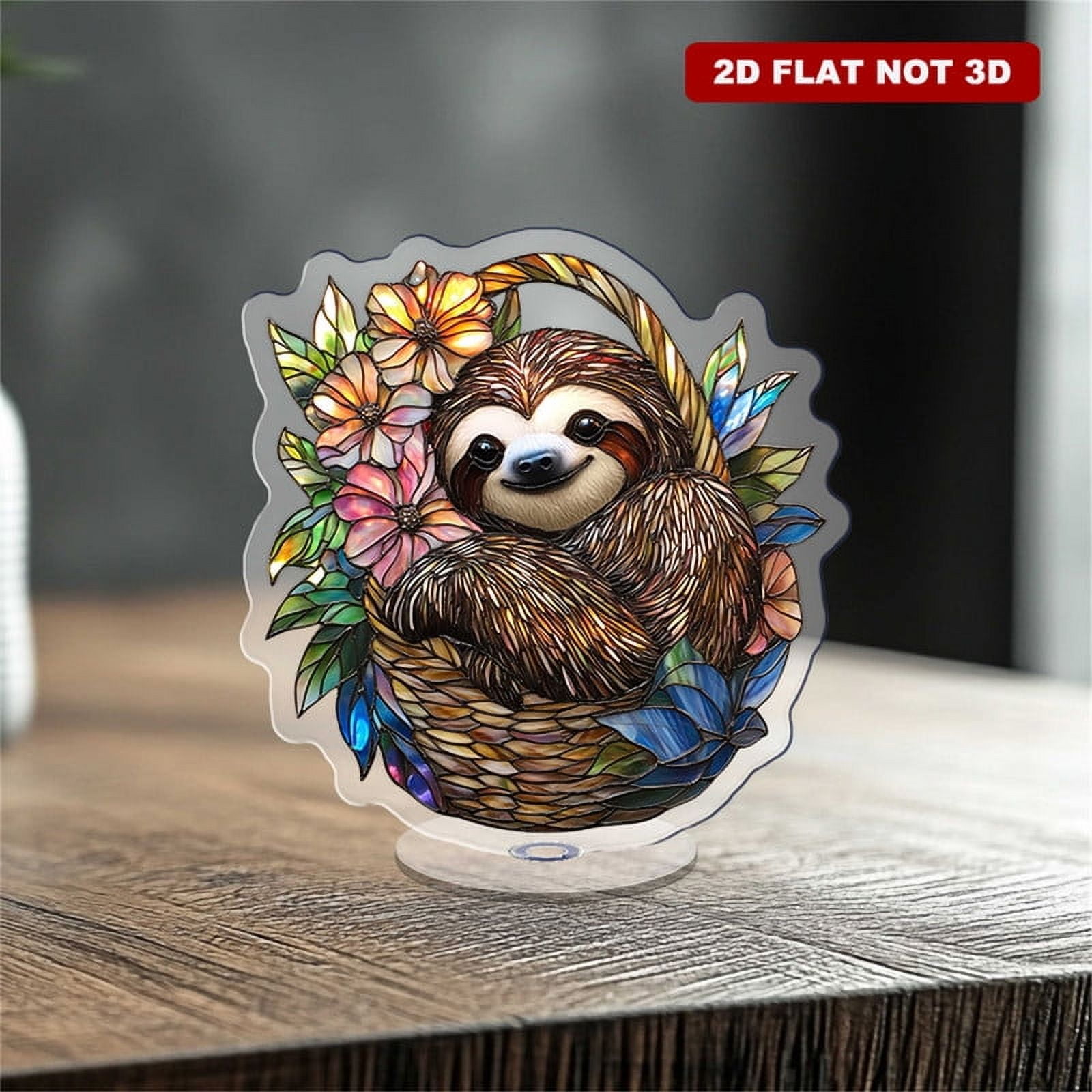 Rotating acrylic ornament featuring a glowing sloth in a basket ...