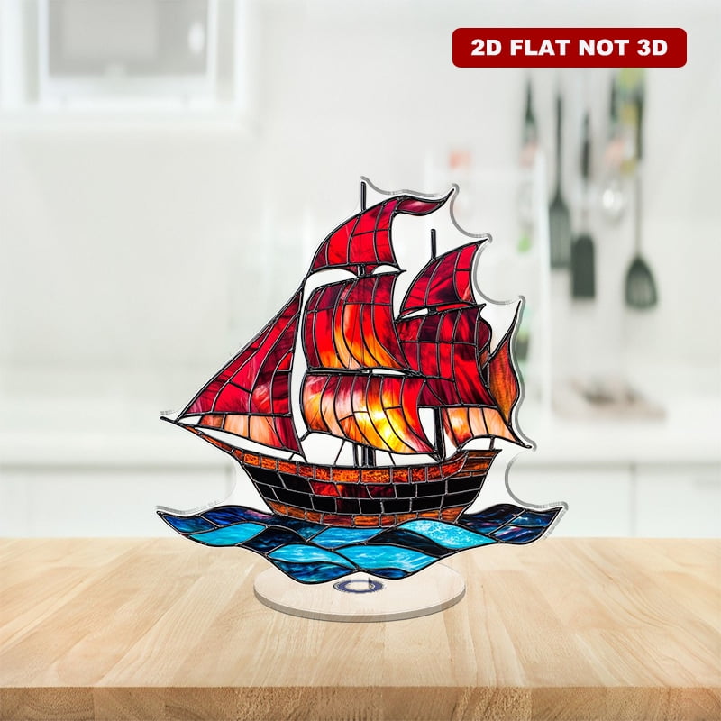 Rotating acrylic ornament featuring a majestic ship with red sails ...