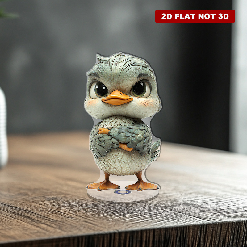 Rotating acrylic ornament featuring a serious cartoon duckling with ...