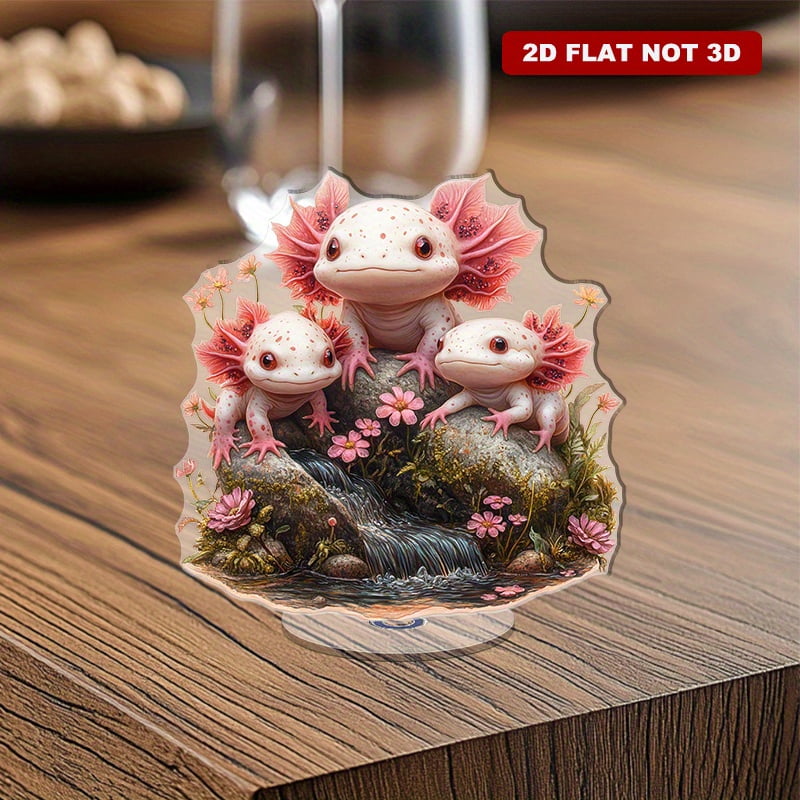 Rotating acrylic ornament featuring three cute Mexican axolotls on a ...