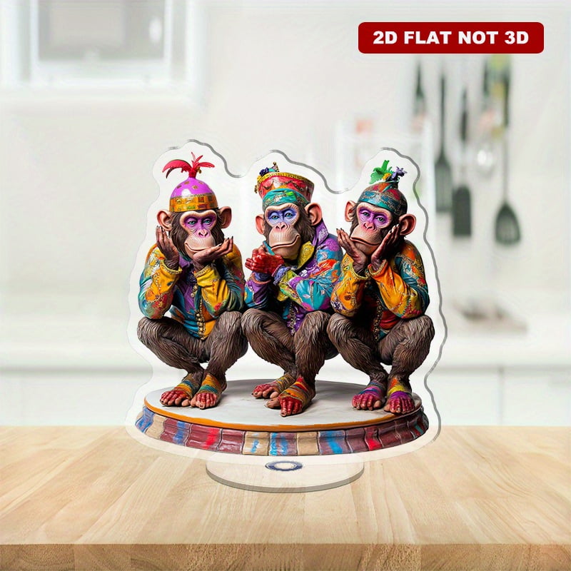 Rotating acrylic ornament featuring three whimsical monkeys in vibrant ...
