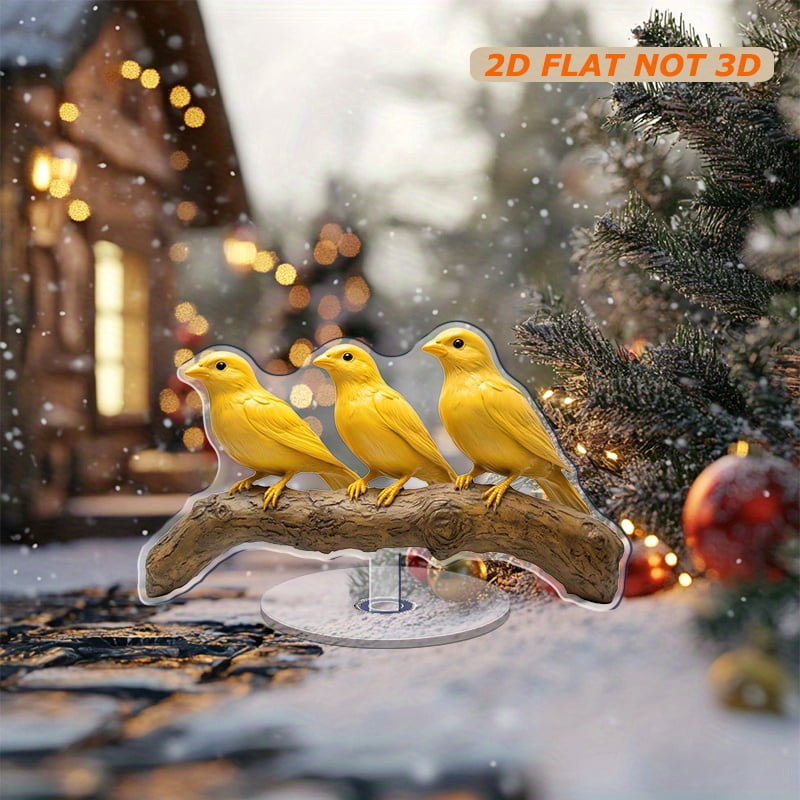 Rotating acrylic ornament featuring three yellow canary birds on a ...