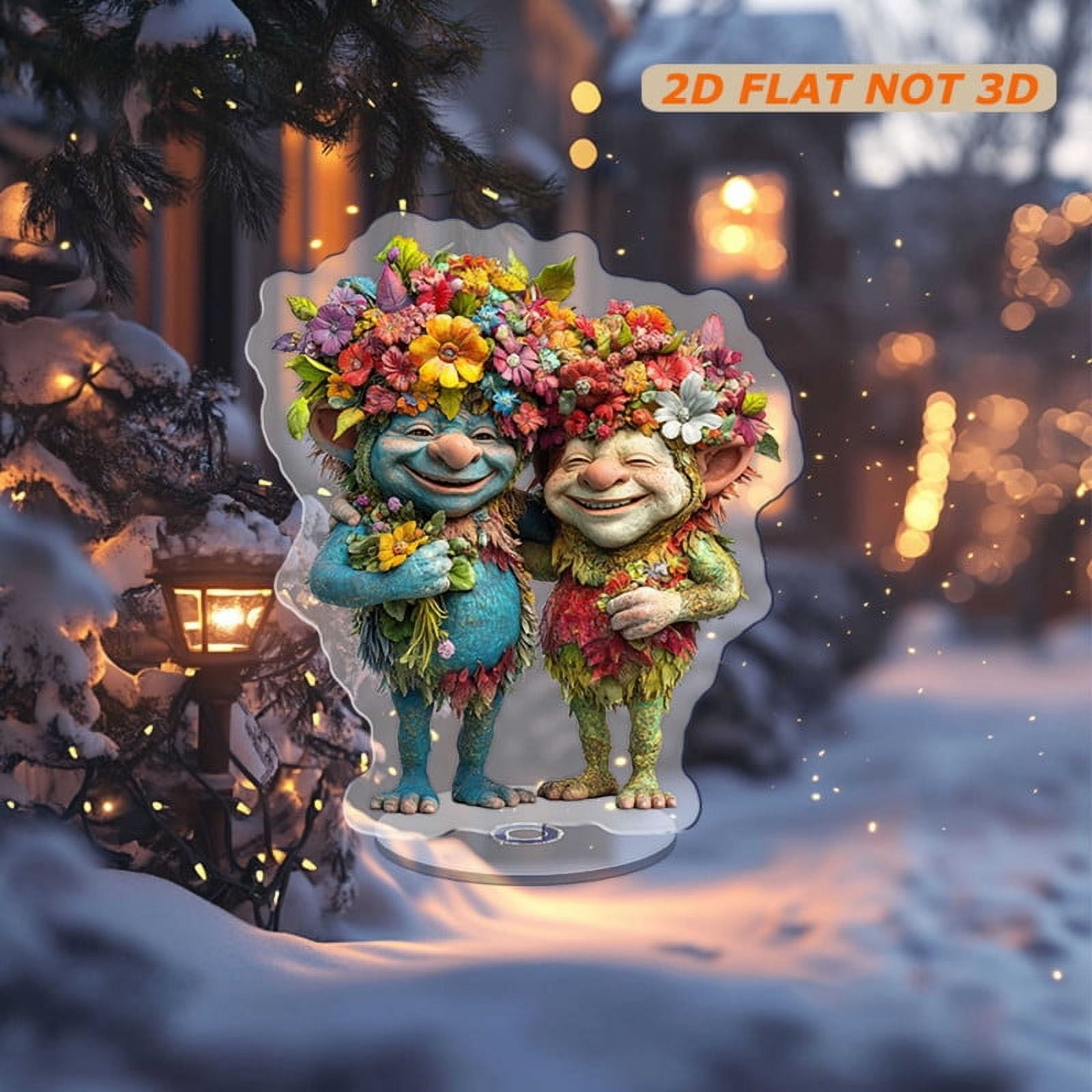 Rotating acrylic ornament featuring trolls with flowers on a white ...