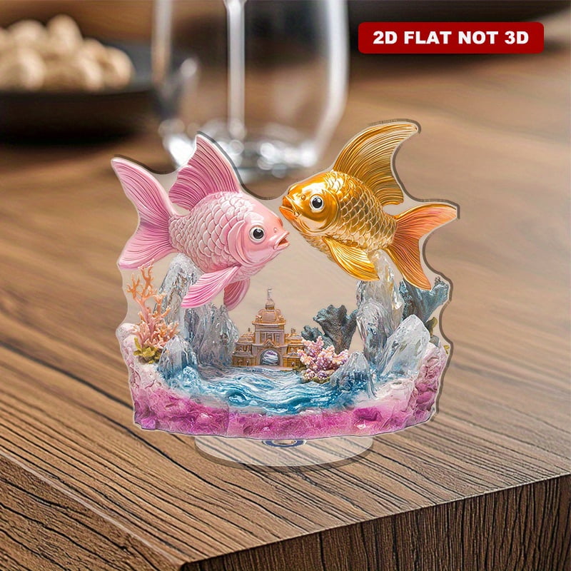 Rotating acrylic ornament featuring two goldfish in a pink ice ...