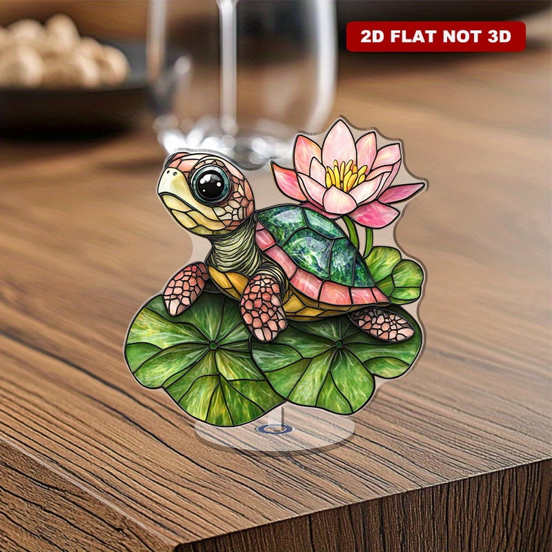 Rotating acrylic piece featuring a vibrant turtle on a lily pad with ...
