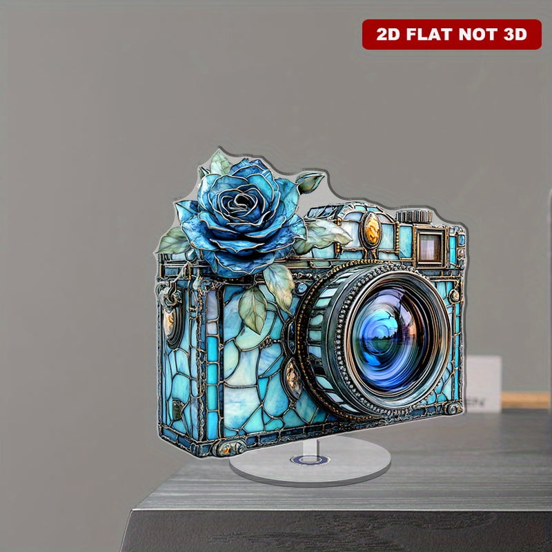 Rotating acrylic sculpture featuring a stained glass camera adorned ...